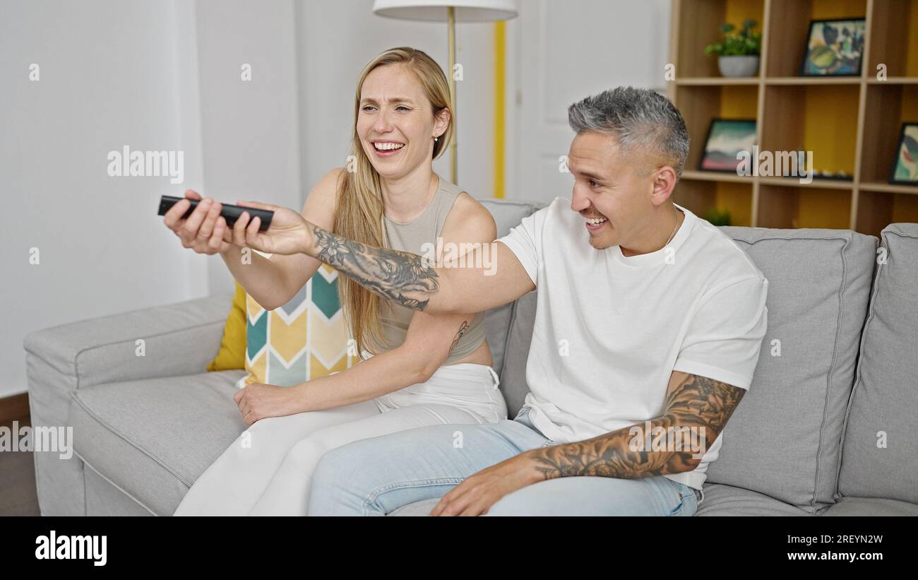 Couple fight remote control hi-res stock photography and images - Alamy