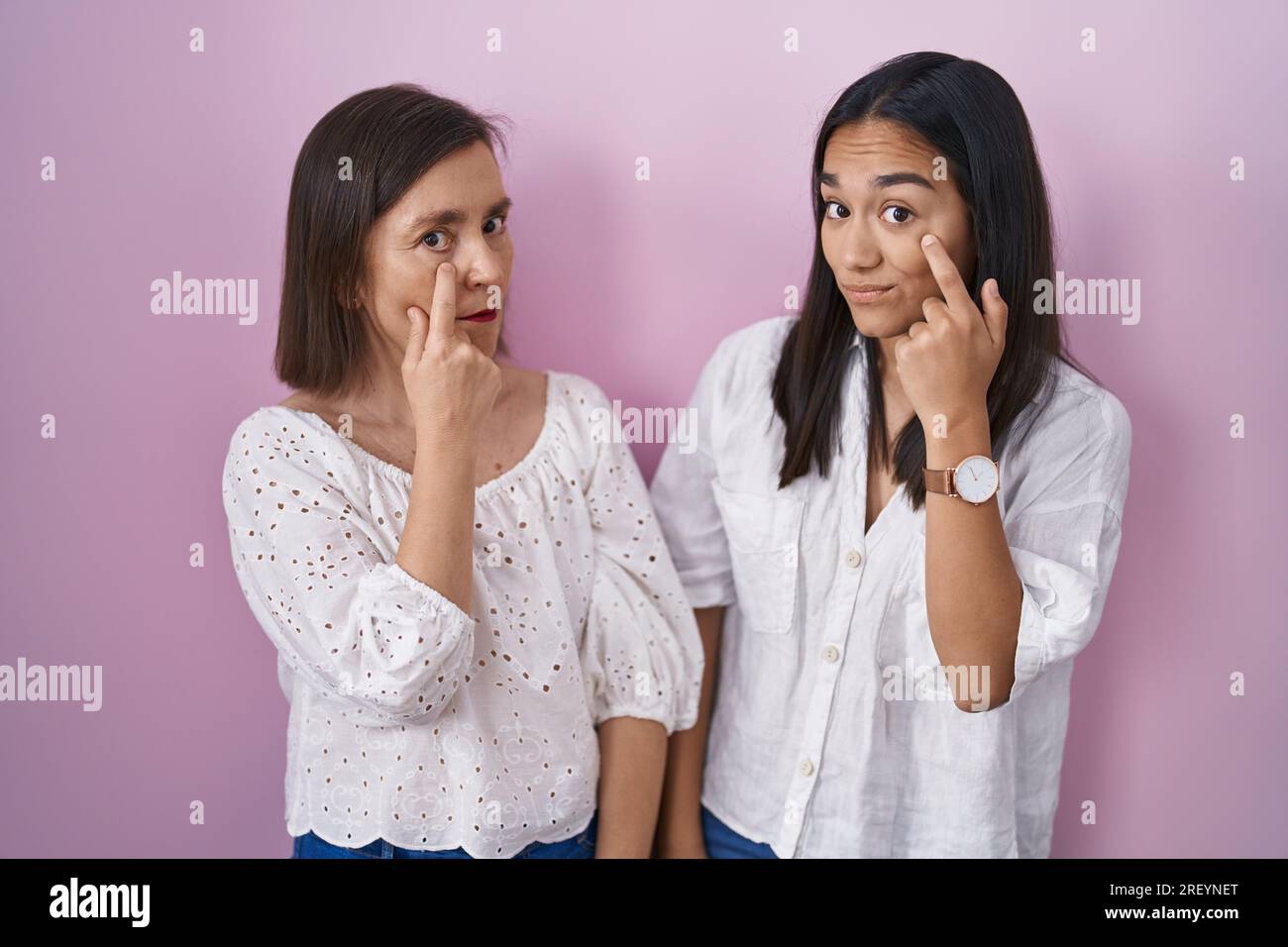 Mother watching daughter suspicious hi-res stock photography and images ...