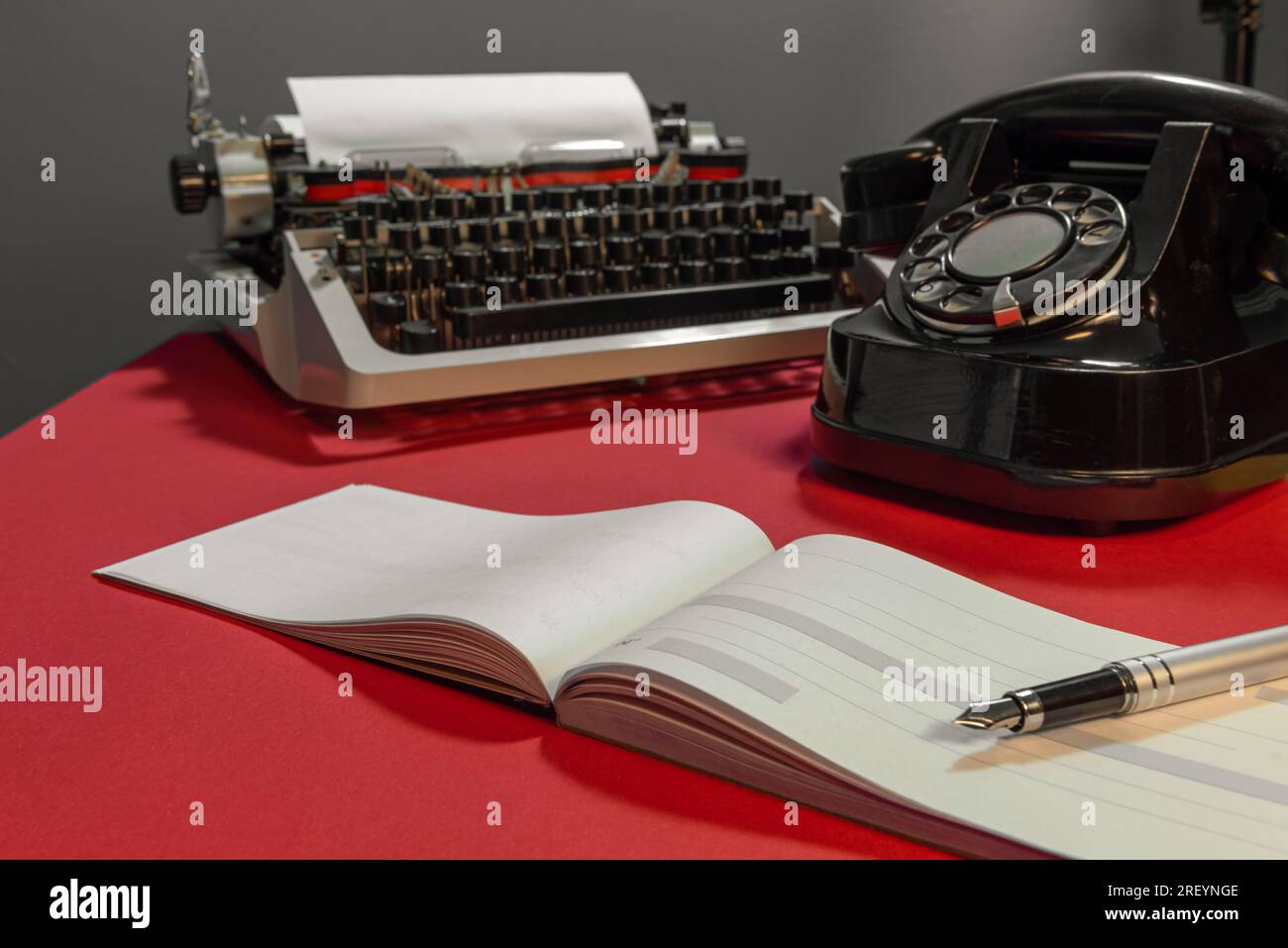 Retro concept with old phone, ink pen and typewriter in color ...