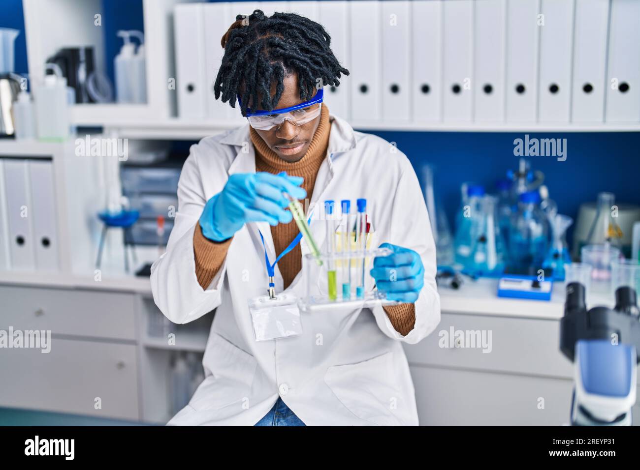 African american man scientist holding test tubes at laboratory Stock ...