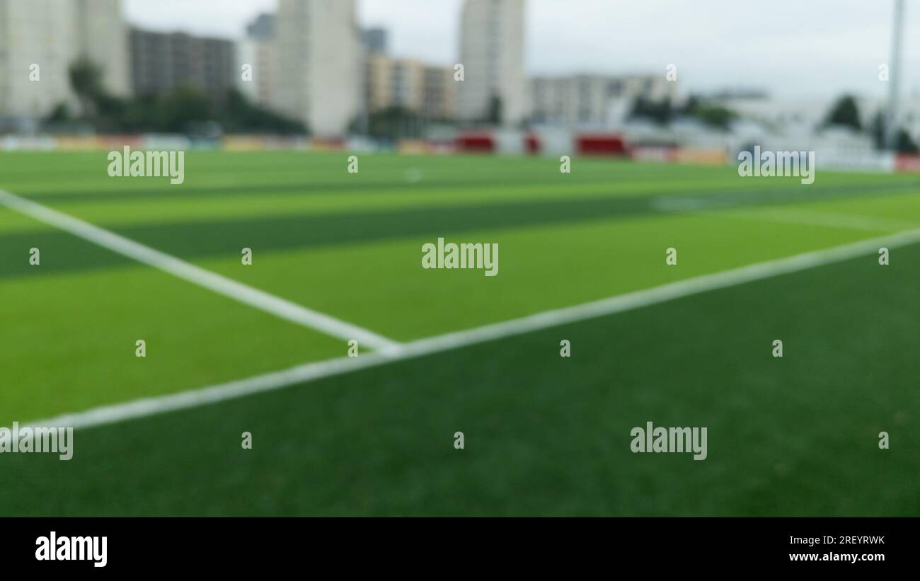 Blurred Empty soccer stadium with green grass and field lines Stock ...