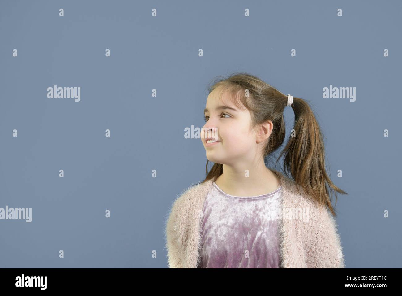 Portrait of an inspired girl in ordinary clothes. With hope for the ...