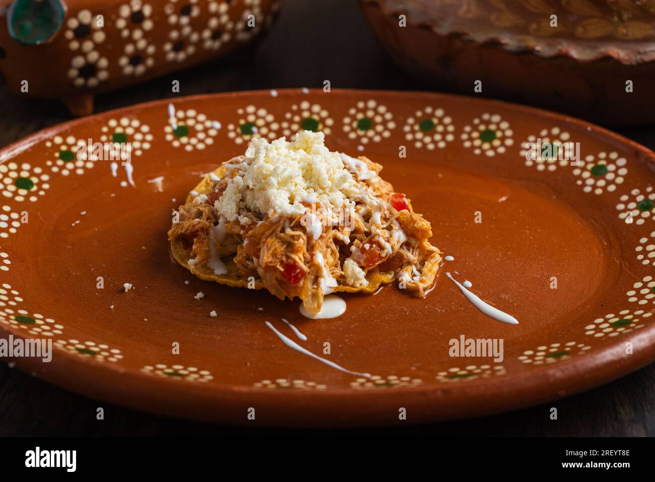 Authentic mexican chicken tinga with fresh cheese and cream on toast ...