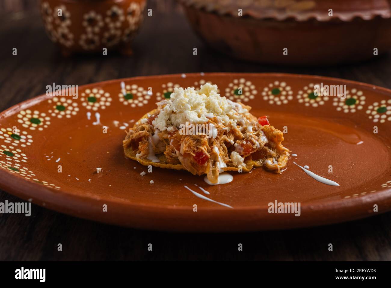 Authentic mexican chicken tinga with fresh cheese and cream on toast ...