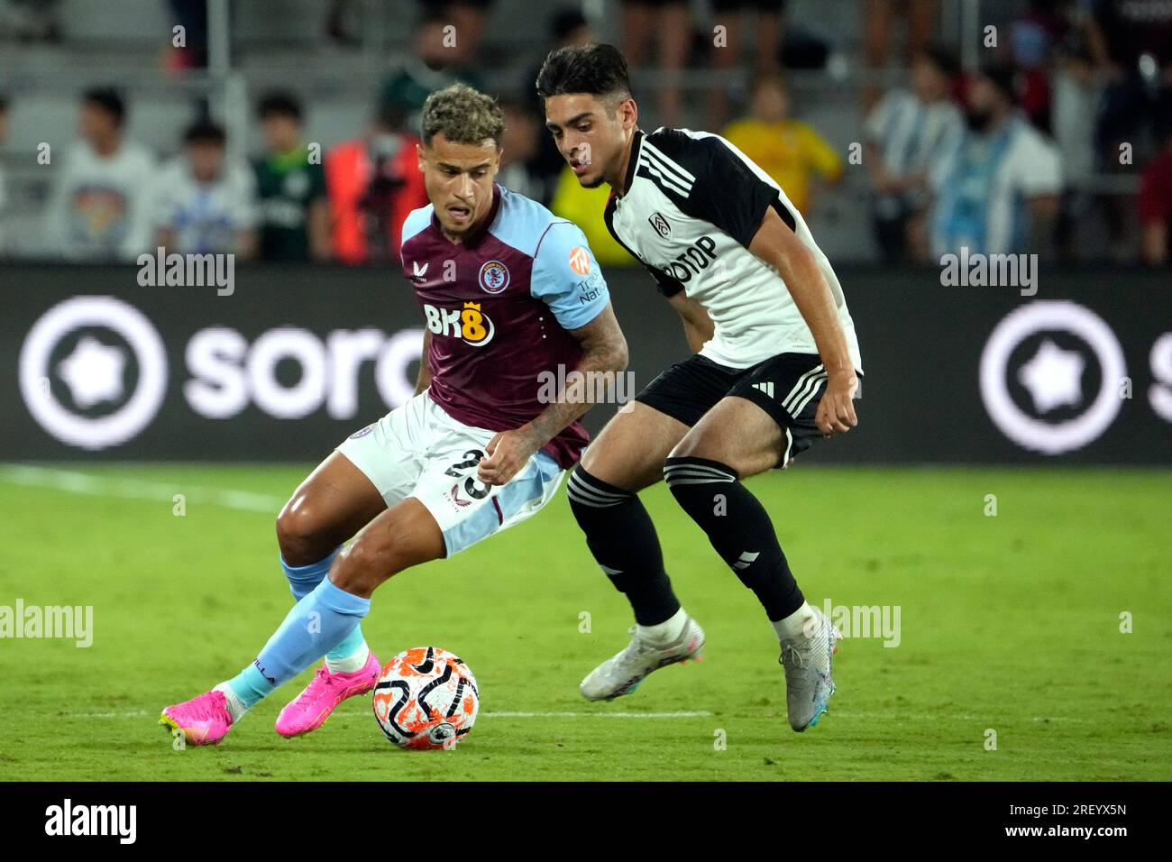 Aston Villa's Philippe Coutinho (23) advances the ball past Fulham's Matthew Dibley-Dias, right ...