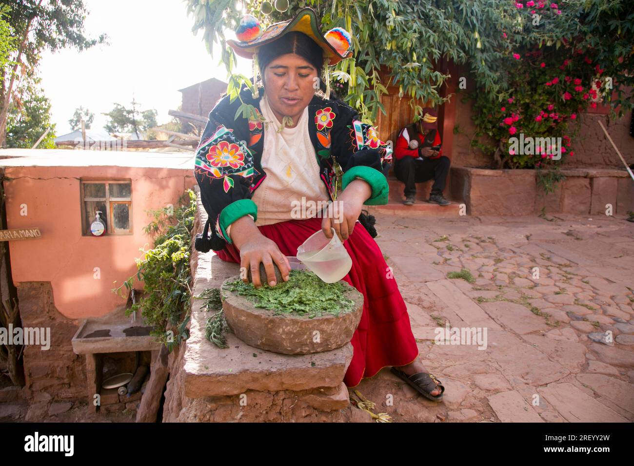 Llachon, Peru; 1st January 2023: Woman preparing natural organic plant ...