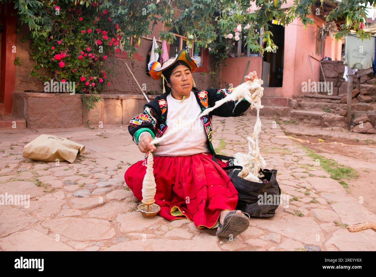 Llachon, Peru; 1st January 2023: A woman working with wool on the ...