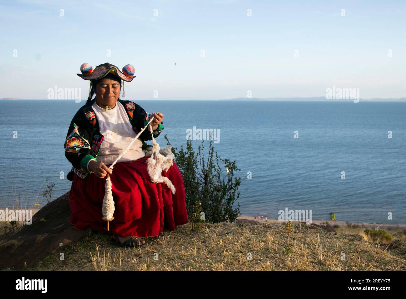 Llachon, Peru; 1st January 2023: A woman working with wool on the ...