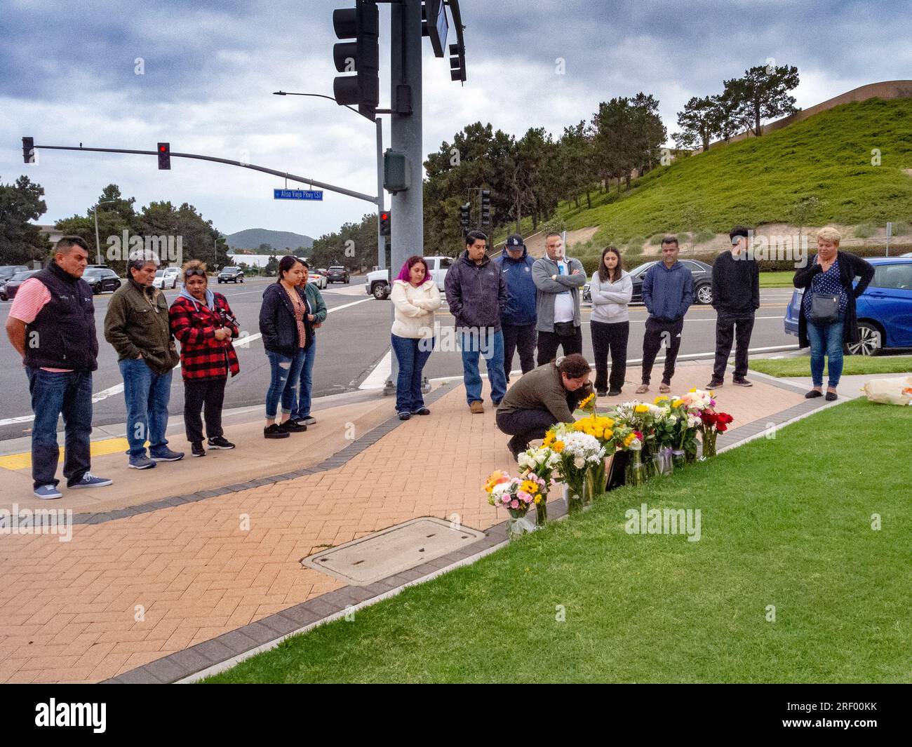 Multiracial friends and family of a traffic accident victim gather for ...