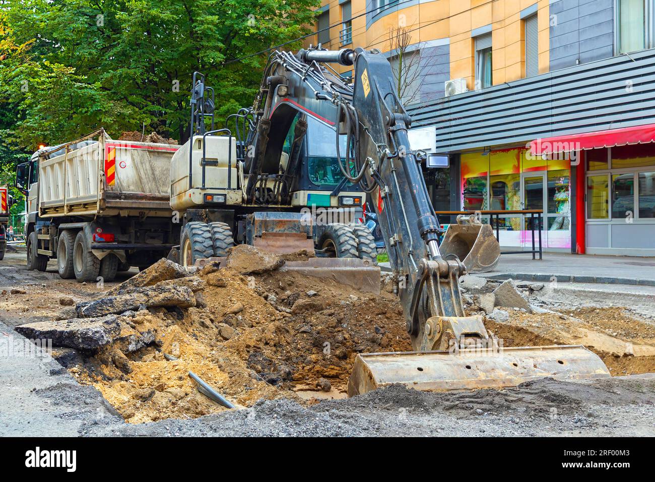 Construction site with modern machines on urban city street Stock Photo ...