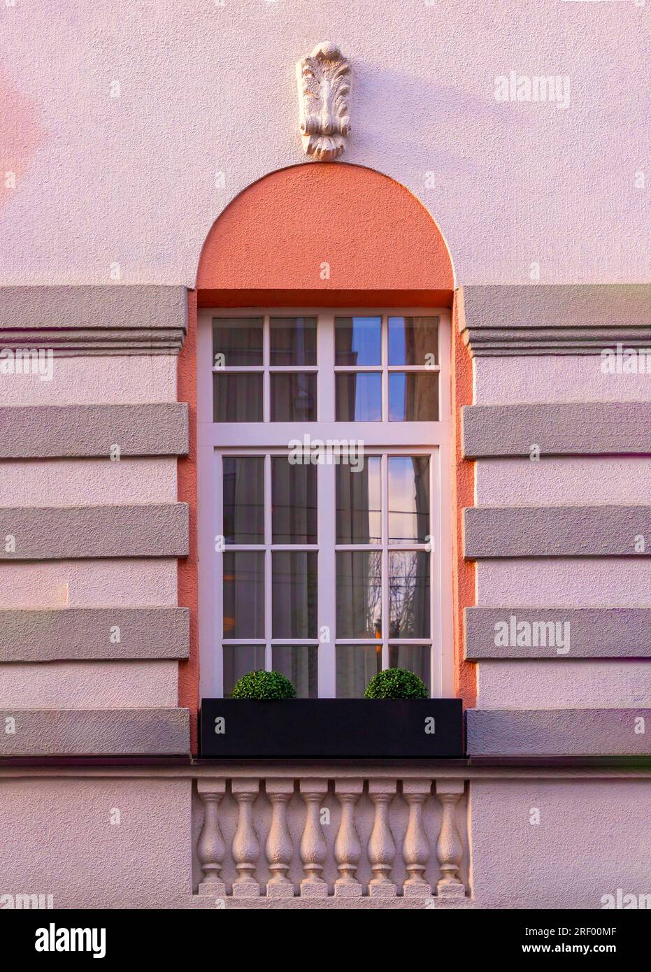 Old retro closed window with decorative pillars on stone facade Stock ...