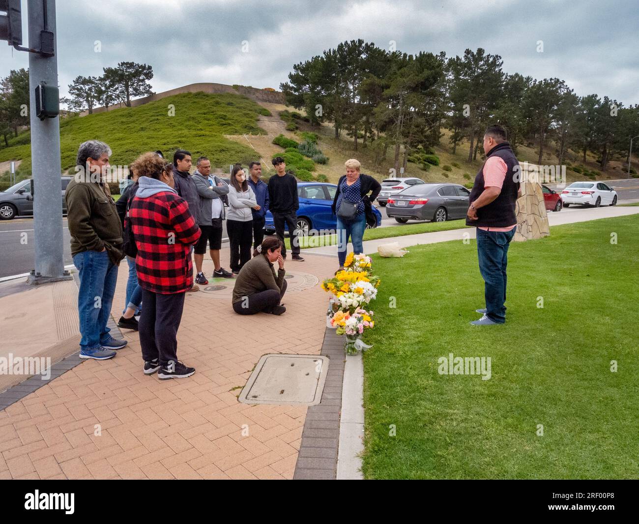 Multiracial friends and family of a traffic accident victim gather for ...