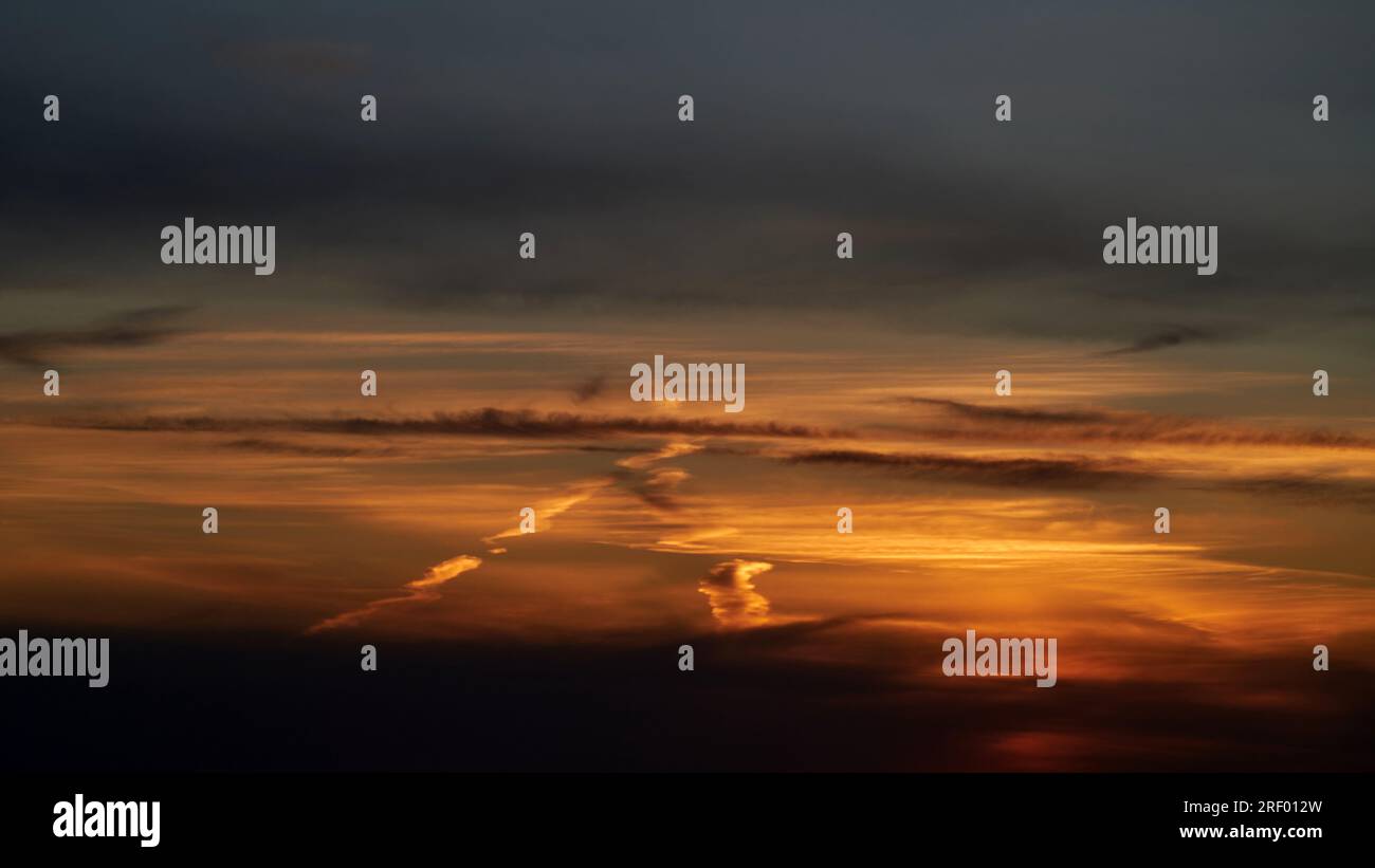 The dark clouds loomed over the horizon, creating a sense of foreboding ...