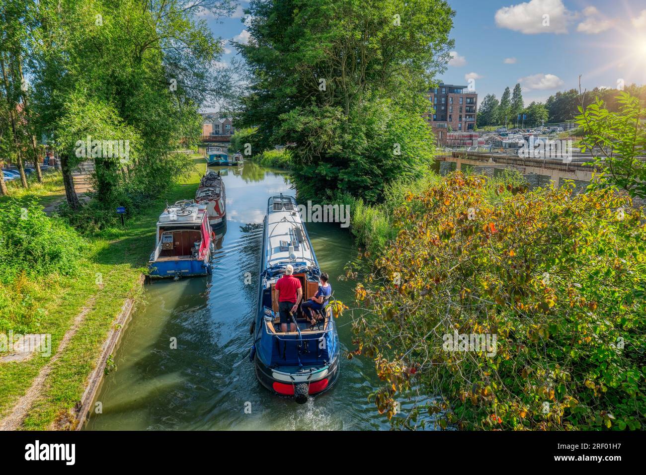 UK, Bedford, old river channel boats sailing upstream, senior citizens ...