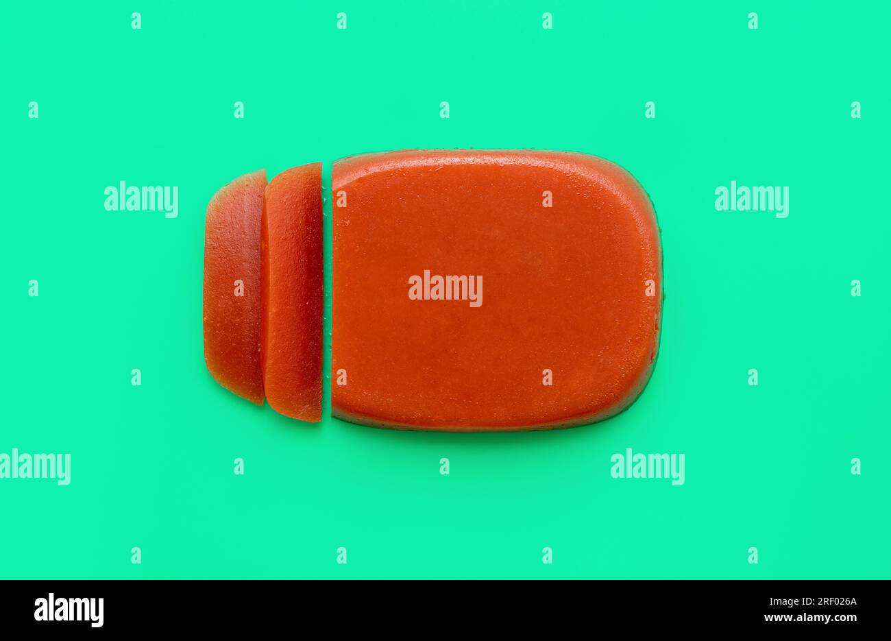 Above view with quince marmalade on a green table. Spanish traditional ...