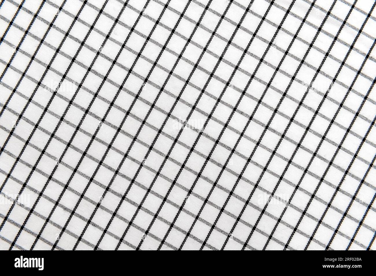 Texture of black and white fabric in a cage. Checkered material ...