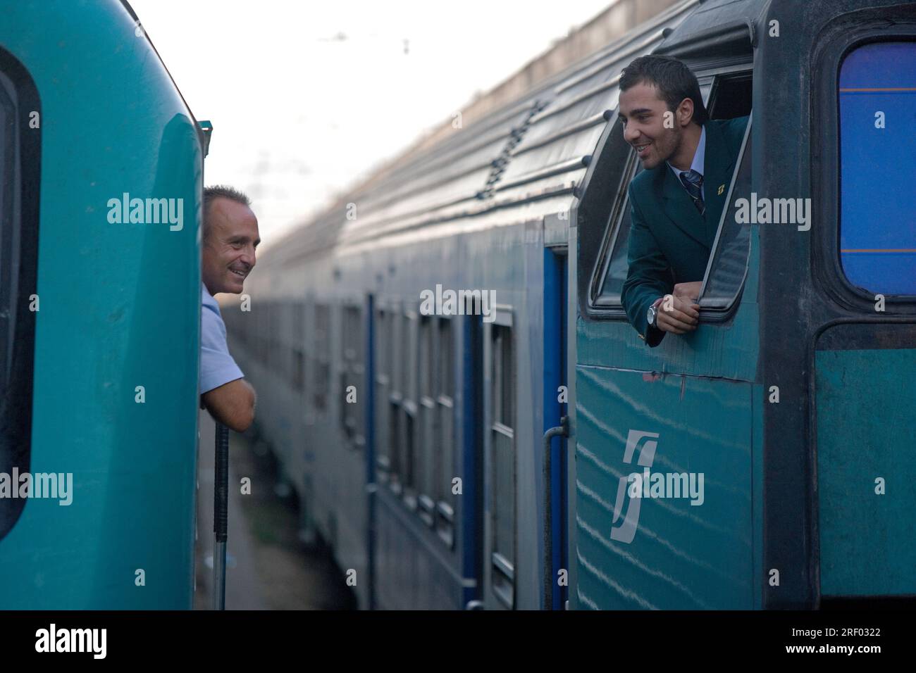 Train drivers chatting at Milan railway cdentral station,Trenitalia ...