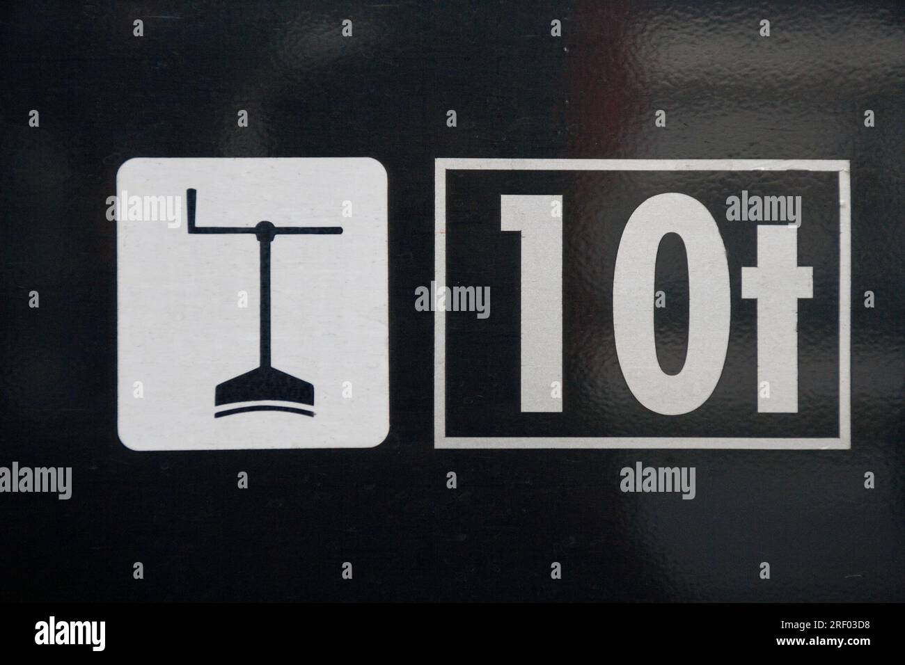 A sign indicating a lifting device's capacity of 10 tons Stock Photo ...
