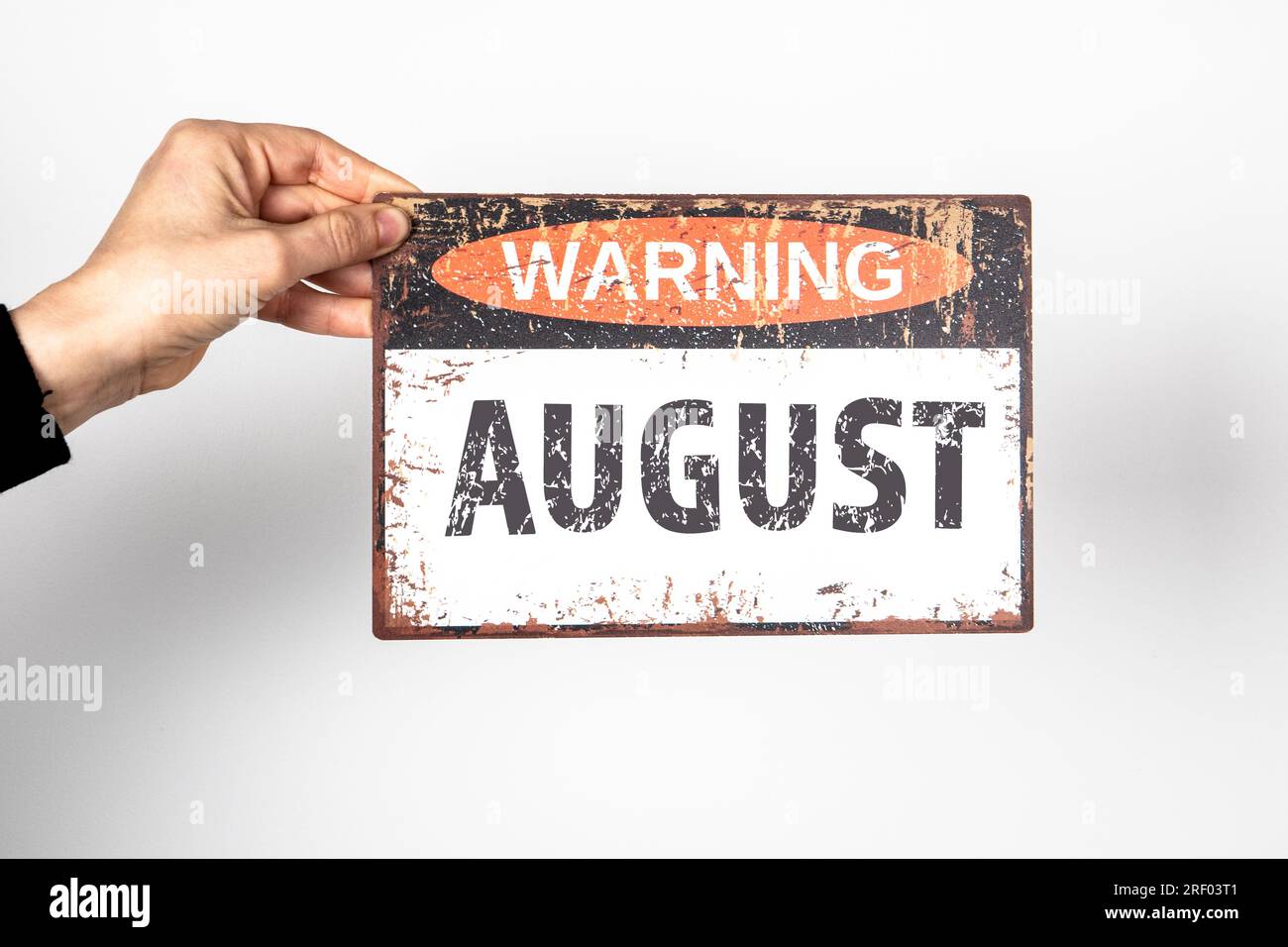 AUGUST. Warning sign with text on a white background Stock Photo - Alamy