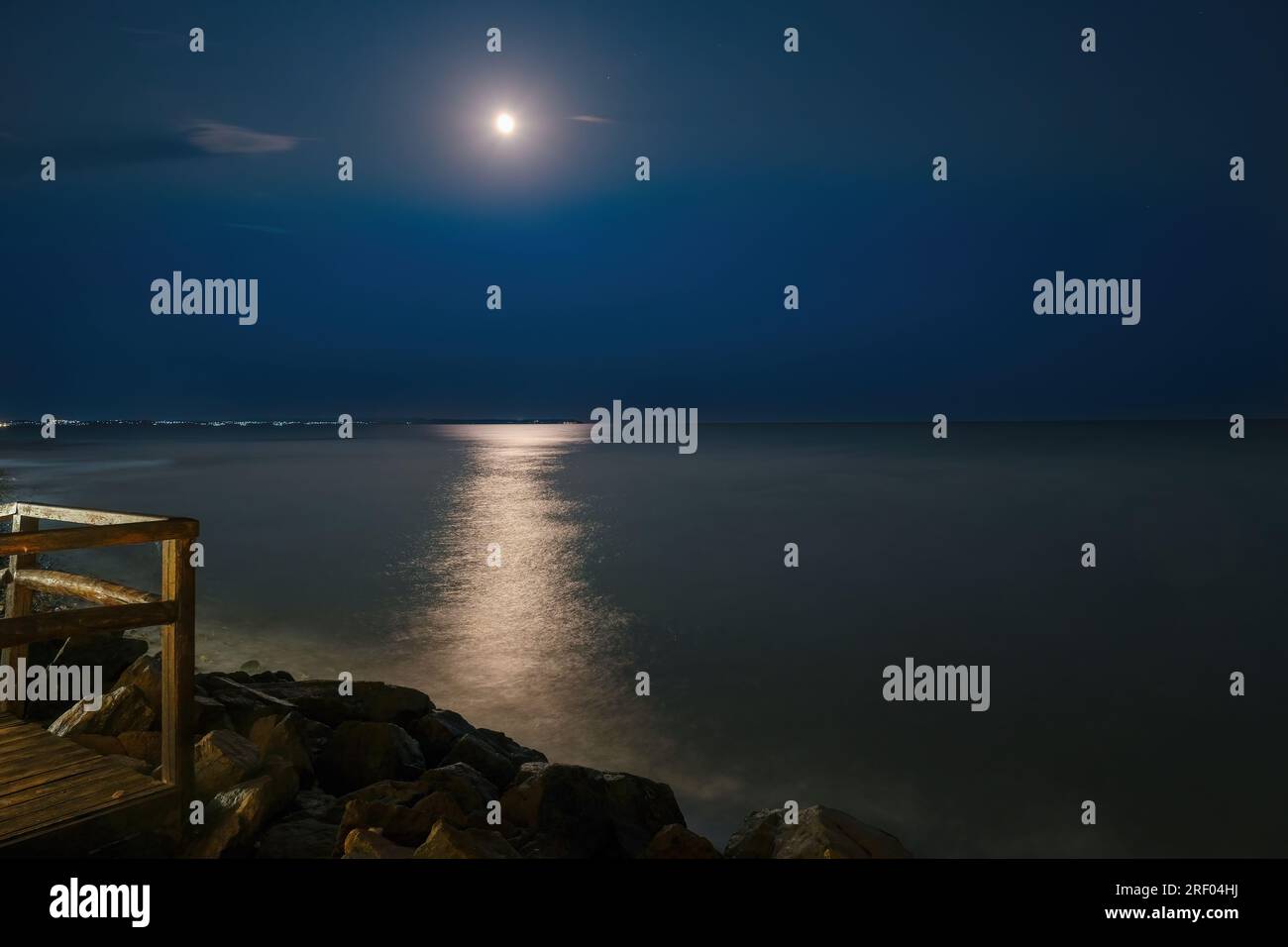 night seascape with full moon and moonlight on dark sky Stock Photo - Alamy