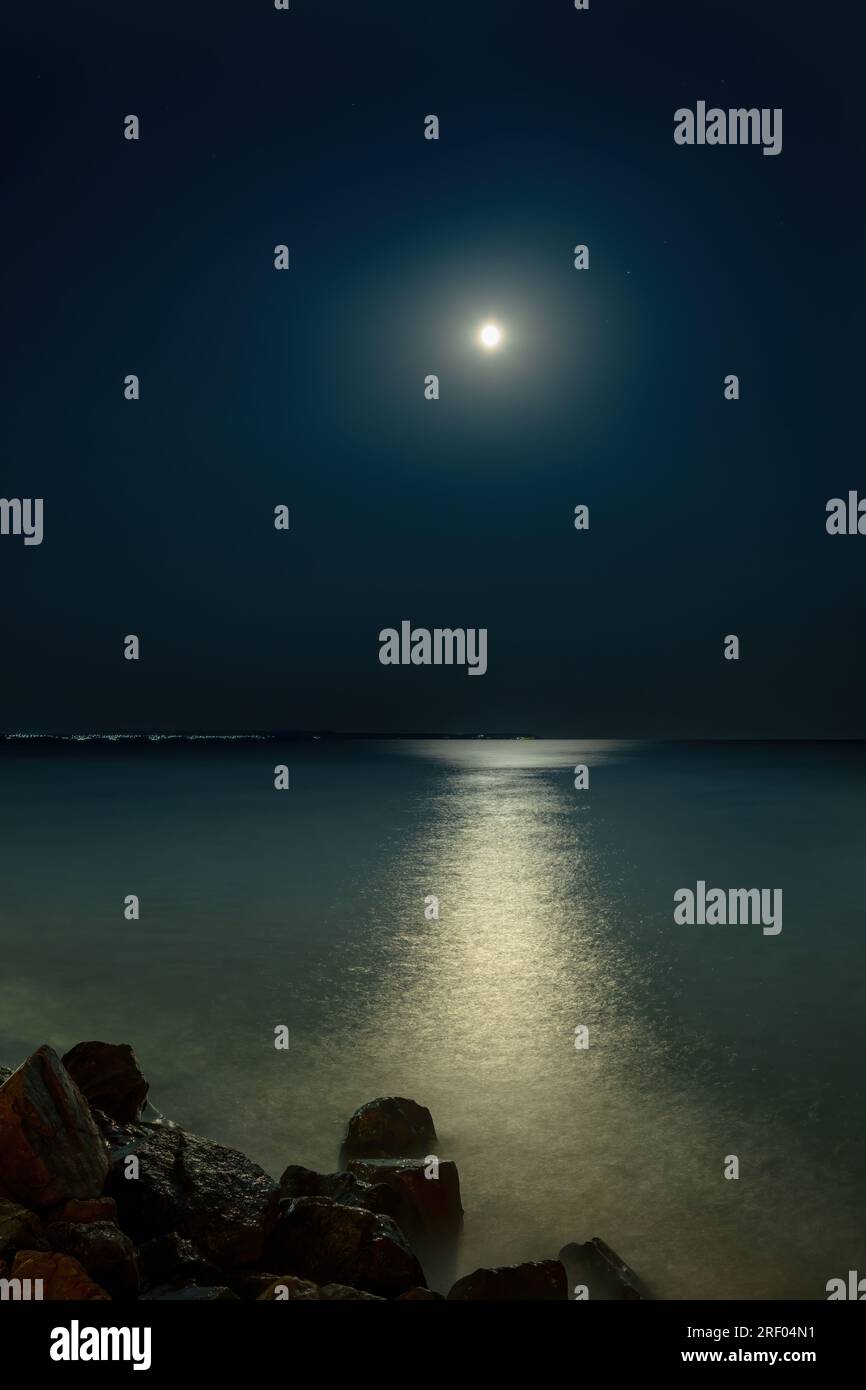 night seascape with full moon and moonlight on dark sky Stock Photo - Alamy