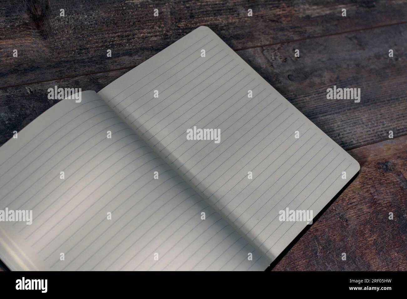 Blank pages an old notebook. On an old table for text Stock Photo - Alamy