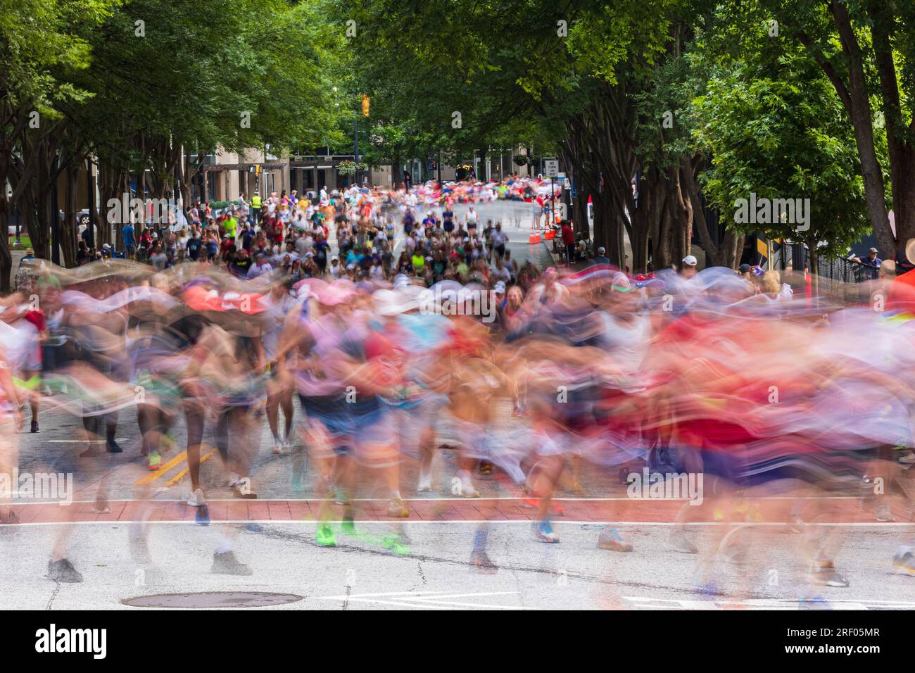 Motion blur shows thousands of unidentifiable runners running in the ...