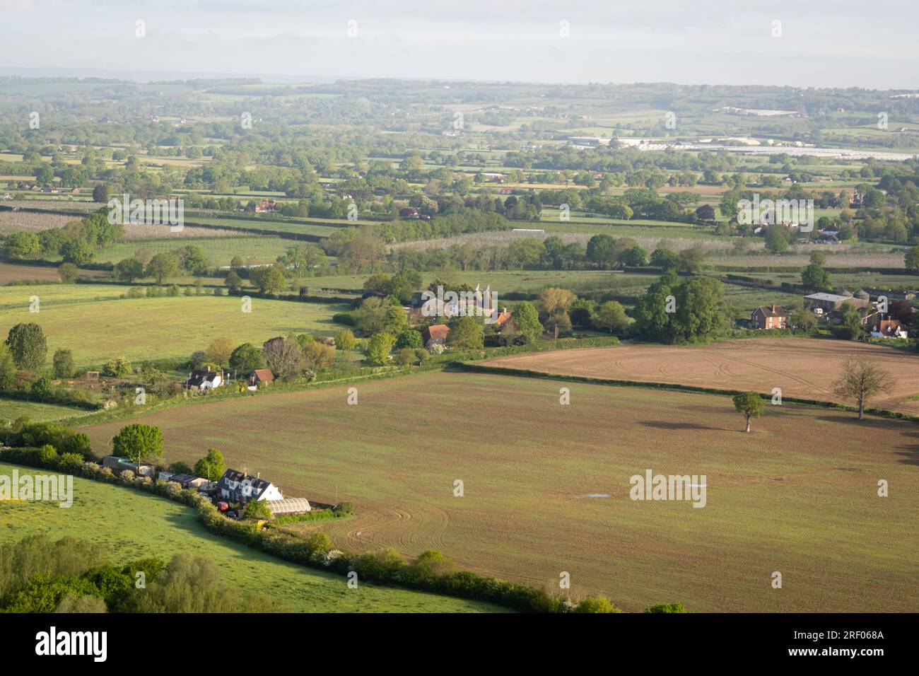 Aerial view of the fields and villages in the countryside in Kent, UK ...