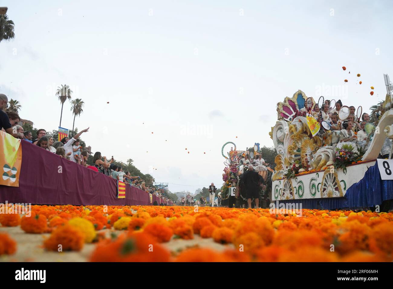 Several people take part in the Battle of Flowers at the July Fair, at ...