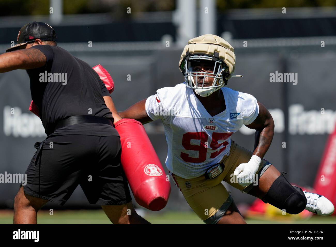 San Francisco 49ers defensive end Drake Jackson, right, takes part in a drill during NFL ...