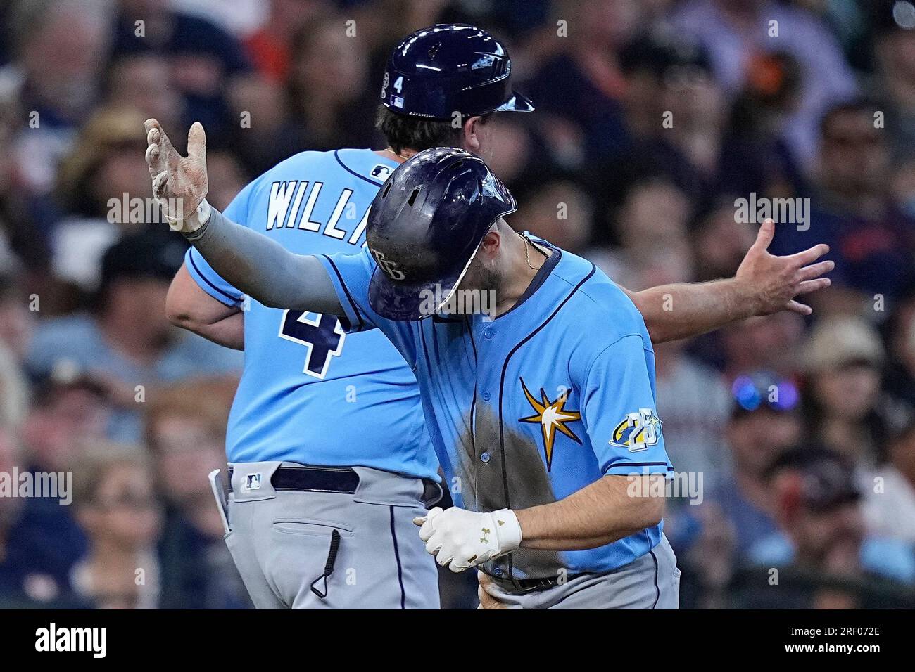 Tampa Bay Rays' Brandon Lowe, right, celebrates with third base coach ...