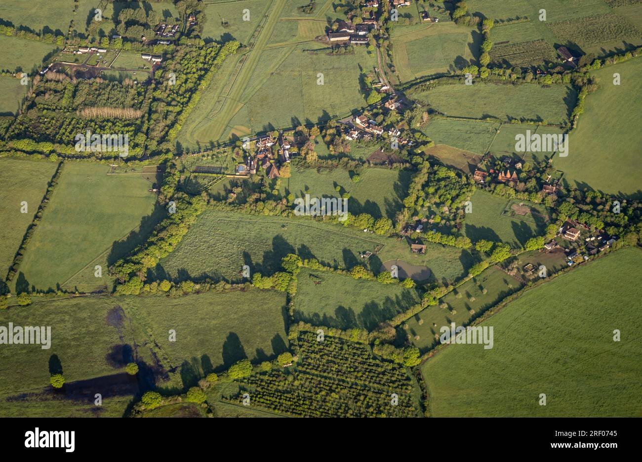 Aerial view of the fields and villages in the countryside in Kent, UK ...