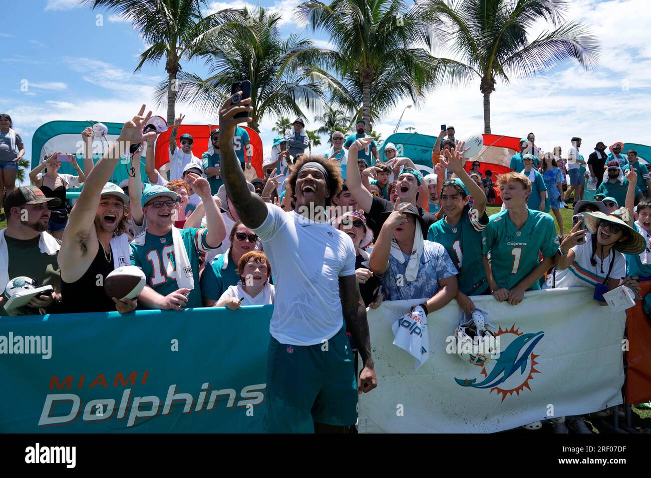 Miami Dolphins safety Jevon Holland poses with fans after practice on ...