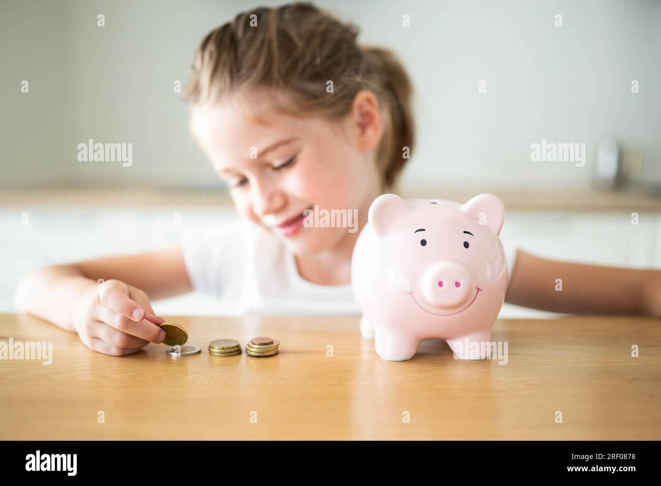 Child counting money hi-res stock photography and images - Alamy