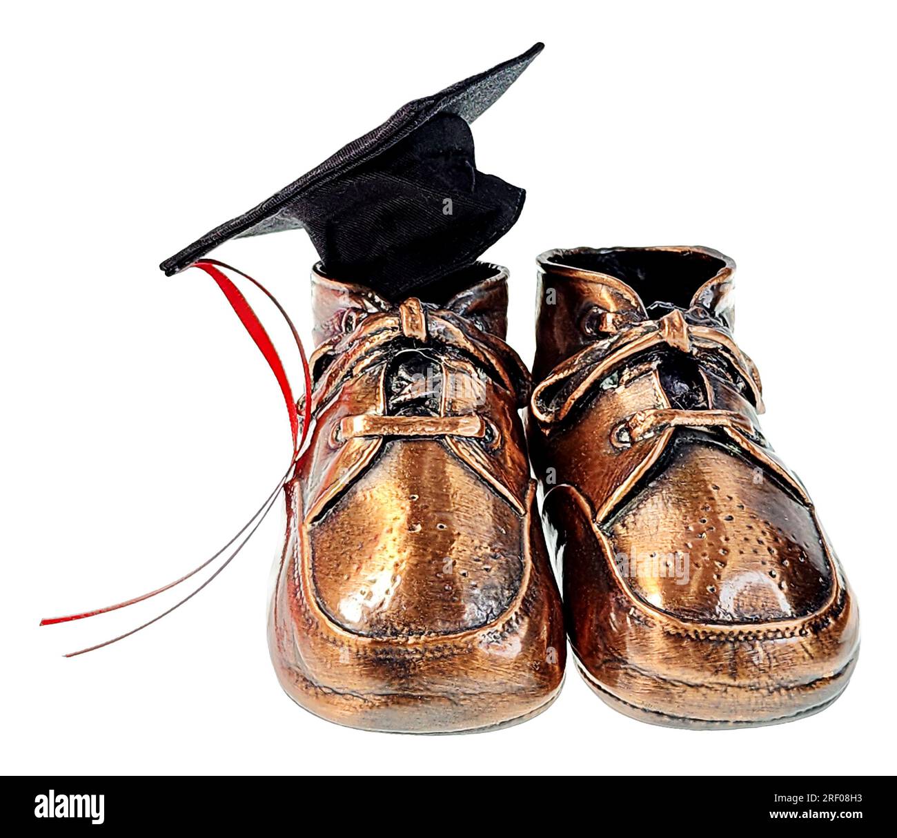 Bronzed baby shoesand graduation cap to show planning for the future ...