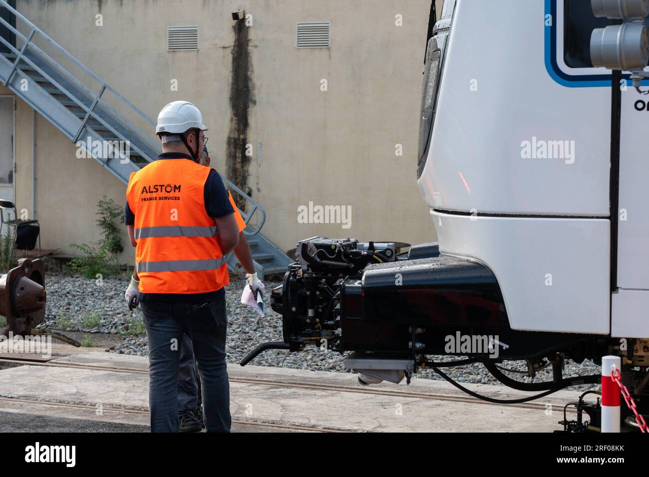 Alstom staff manoeuvre the installations during the delivery of the new ...