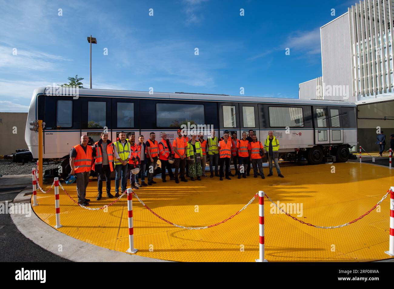 Alstom employees pose for a photo as the first trains for the future ...