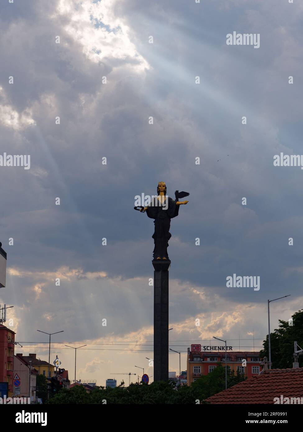 Statue of Sveta Sofia with light cascading through the clouds, Sofia ...