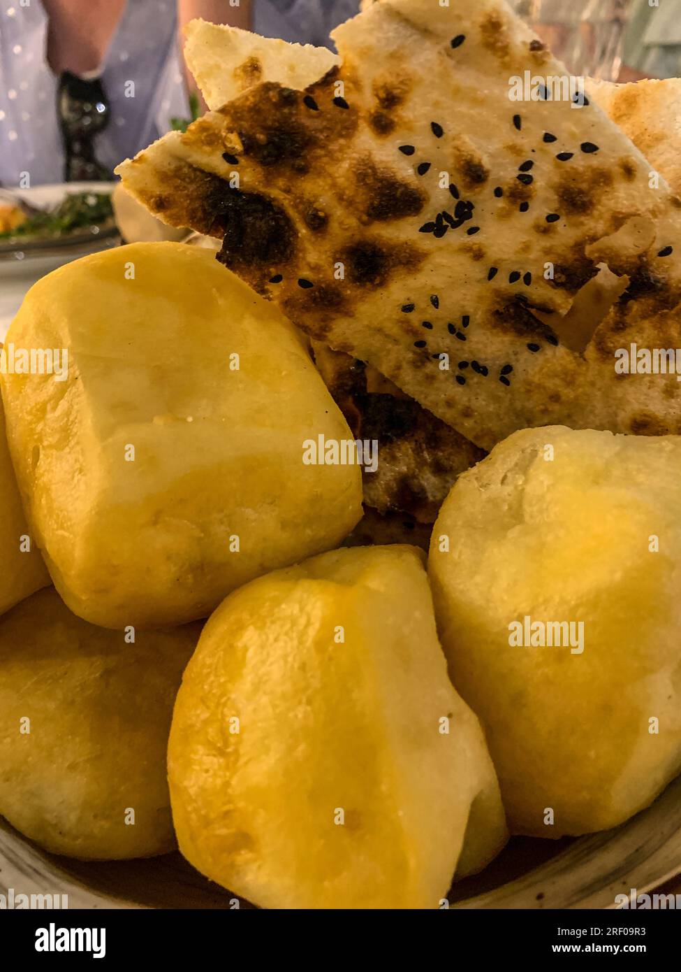 Kazakhstan, Almaty. Tandyr Nan, a Central Asian Bread (top) and Baursak ...
