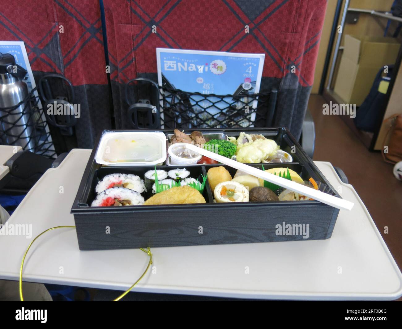 Travel by shinkansen or bullet train: a traditional Japanese Bento Box ...