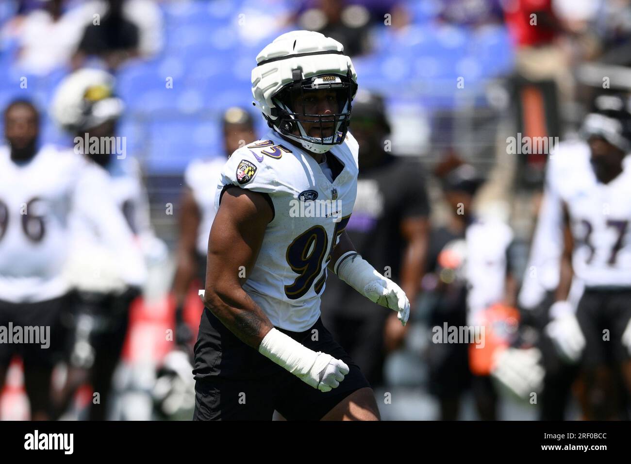 Baltimore Ravens linebacker Tavius Robinson (95) works out during the ...
