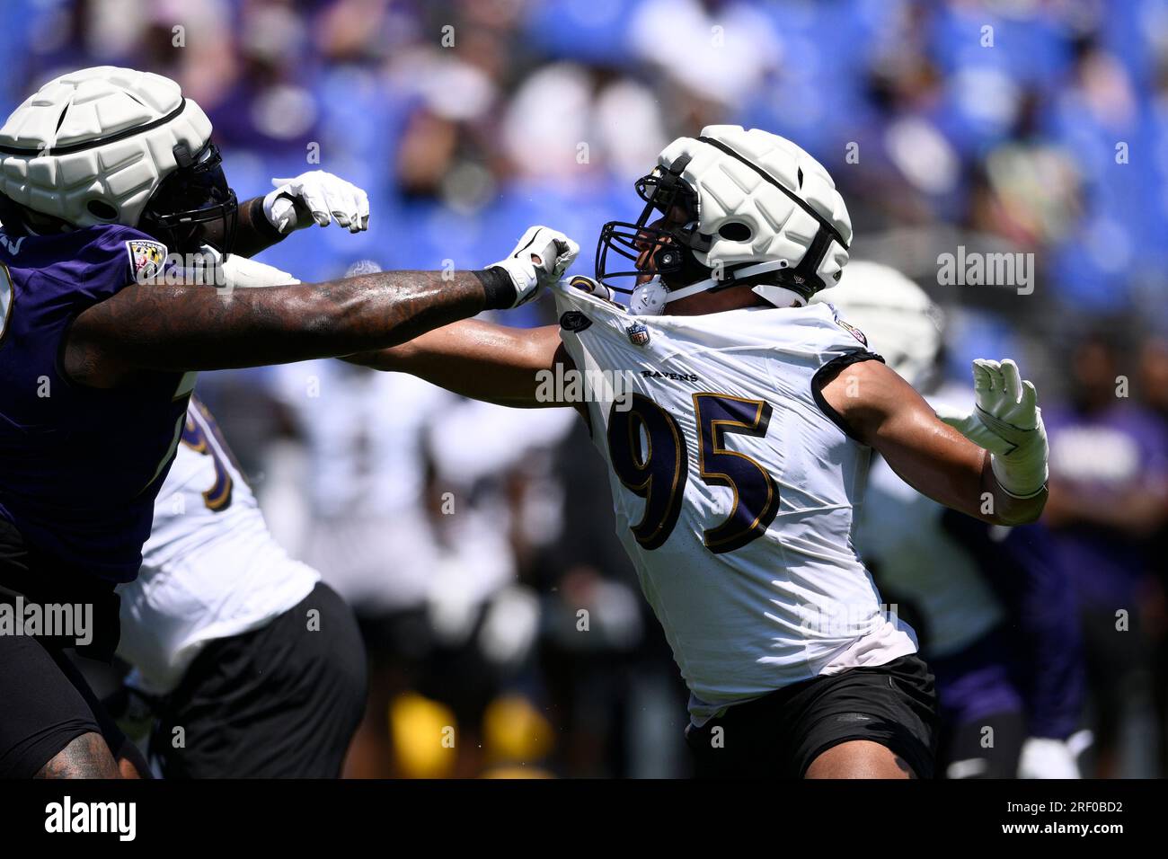 Baltimore Ravens linebacker Tavius Robinson (95) works out during the ...