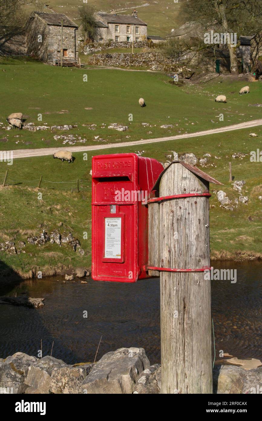 A mounted red post box in the tiny village of Yockenthwaite in the ...