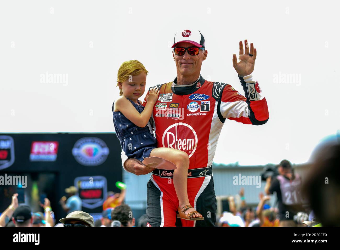 Kevin Harvick and his daughter Piper react on the runway during driver ...