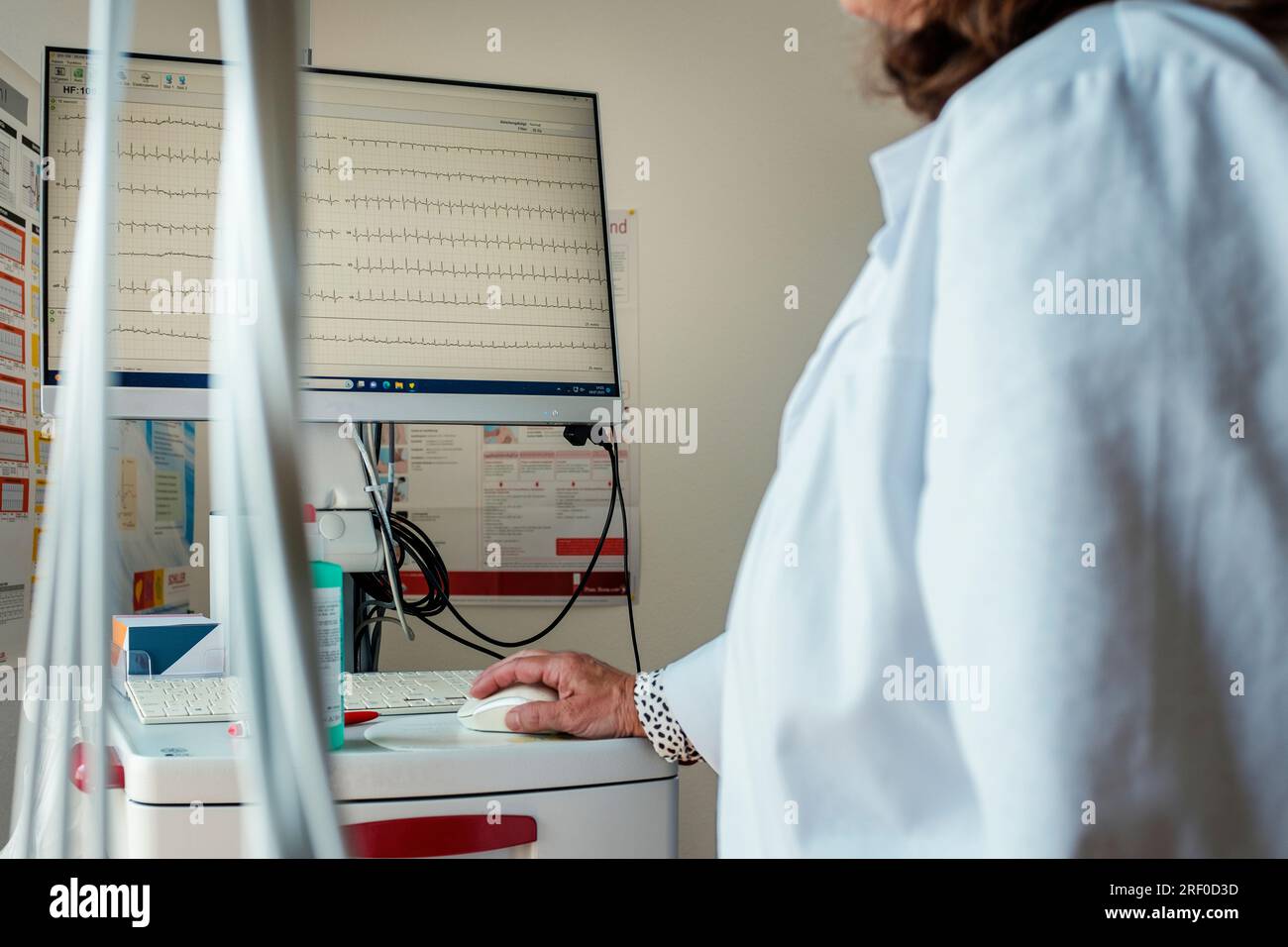 Cardiologist performing ECG electrocardiogram on patient,POV Stock ...