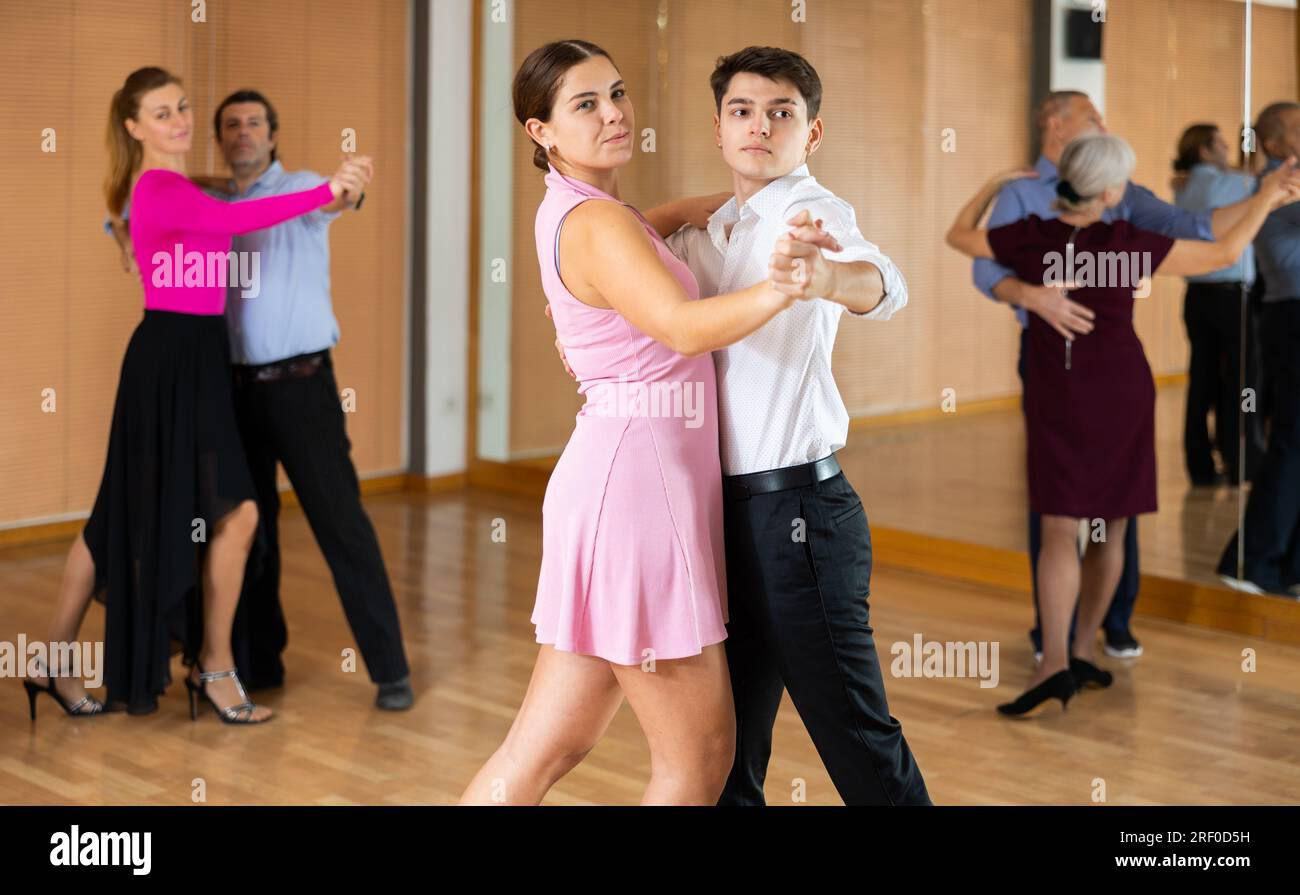 Young pair practicing ballroom dance in dance studio Stock Photo - Alamy