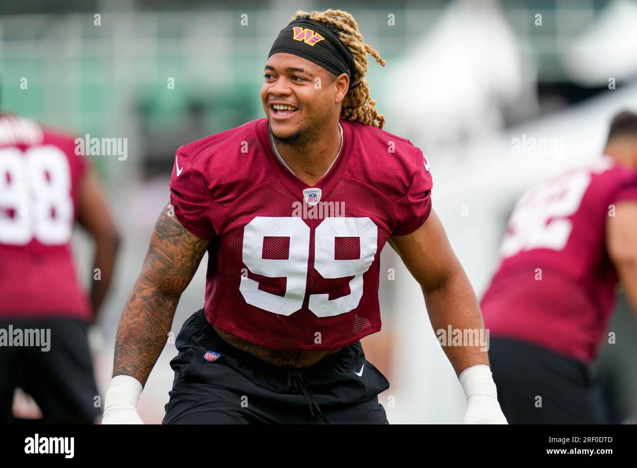 Washington Commanders defensive end Chase Young (99) smiles during a ...