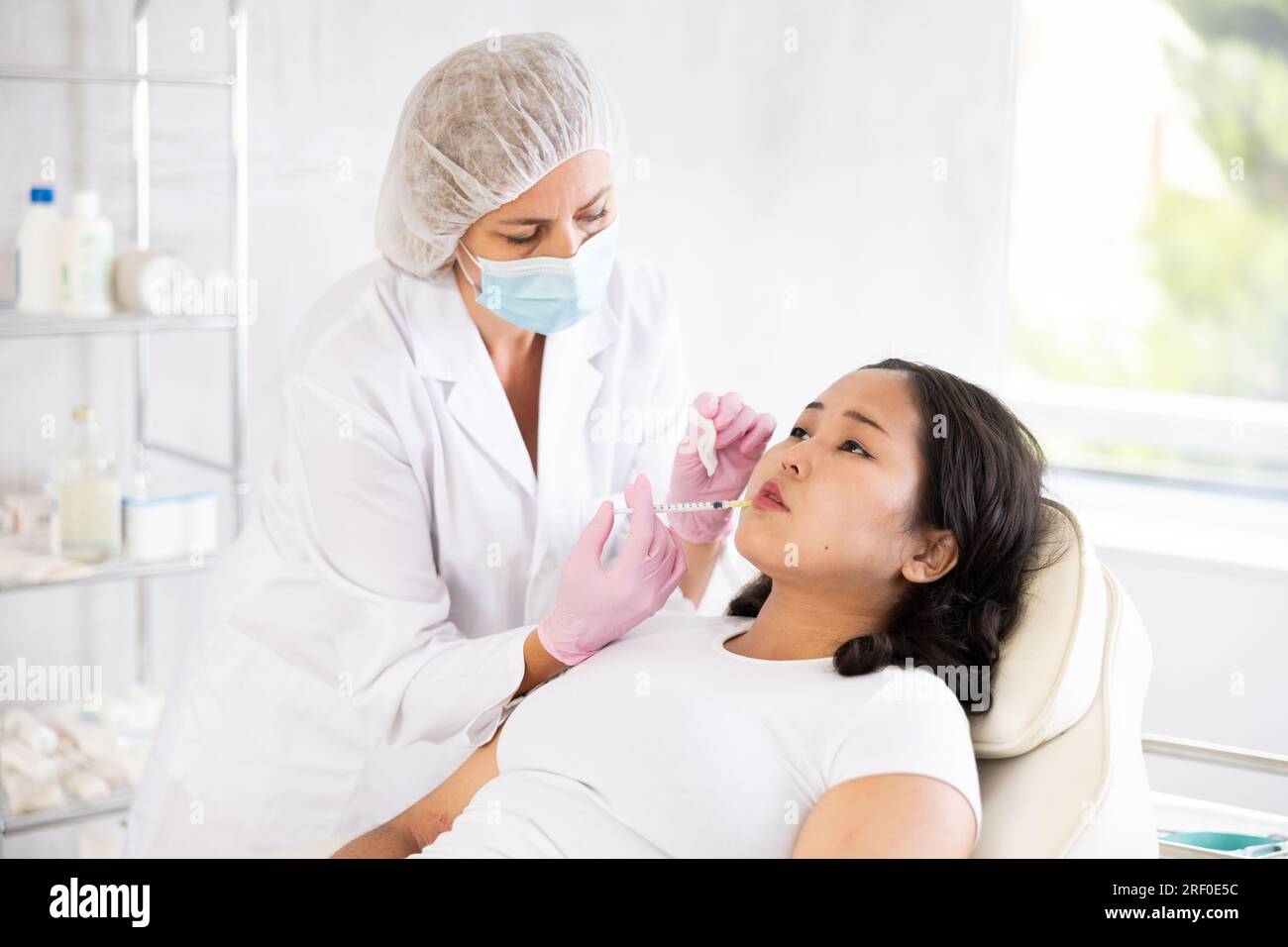 Doctor doing anti-aging beauty procedures Stock Photo - Alamy