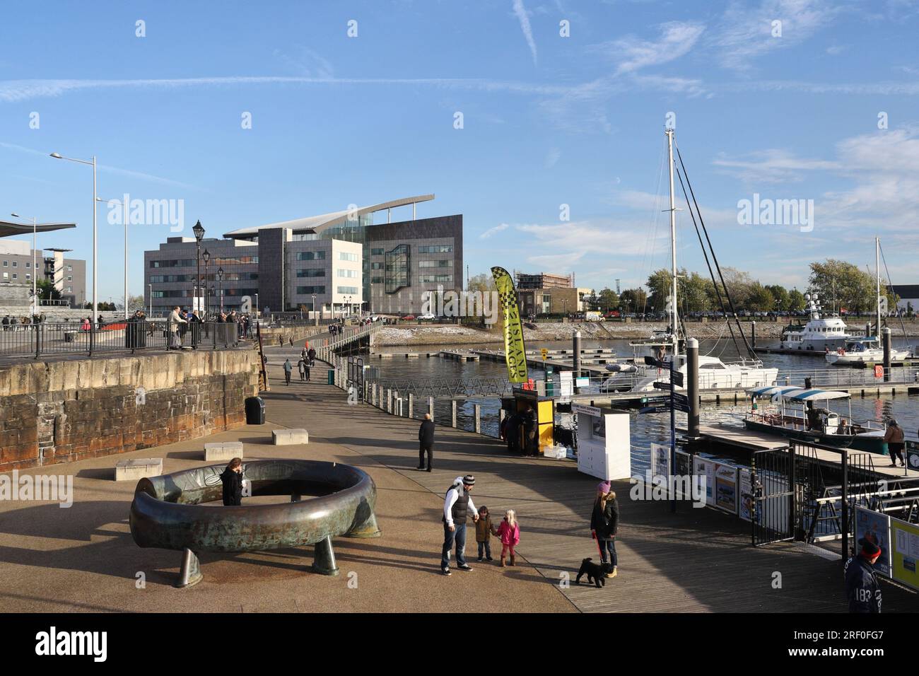 Cardiff Bay waterfront and Mermaid Quay quayside celtic ring sculpture ...