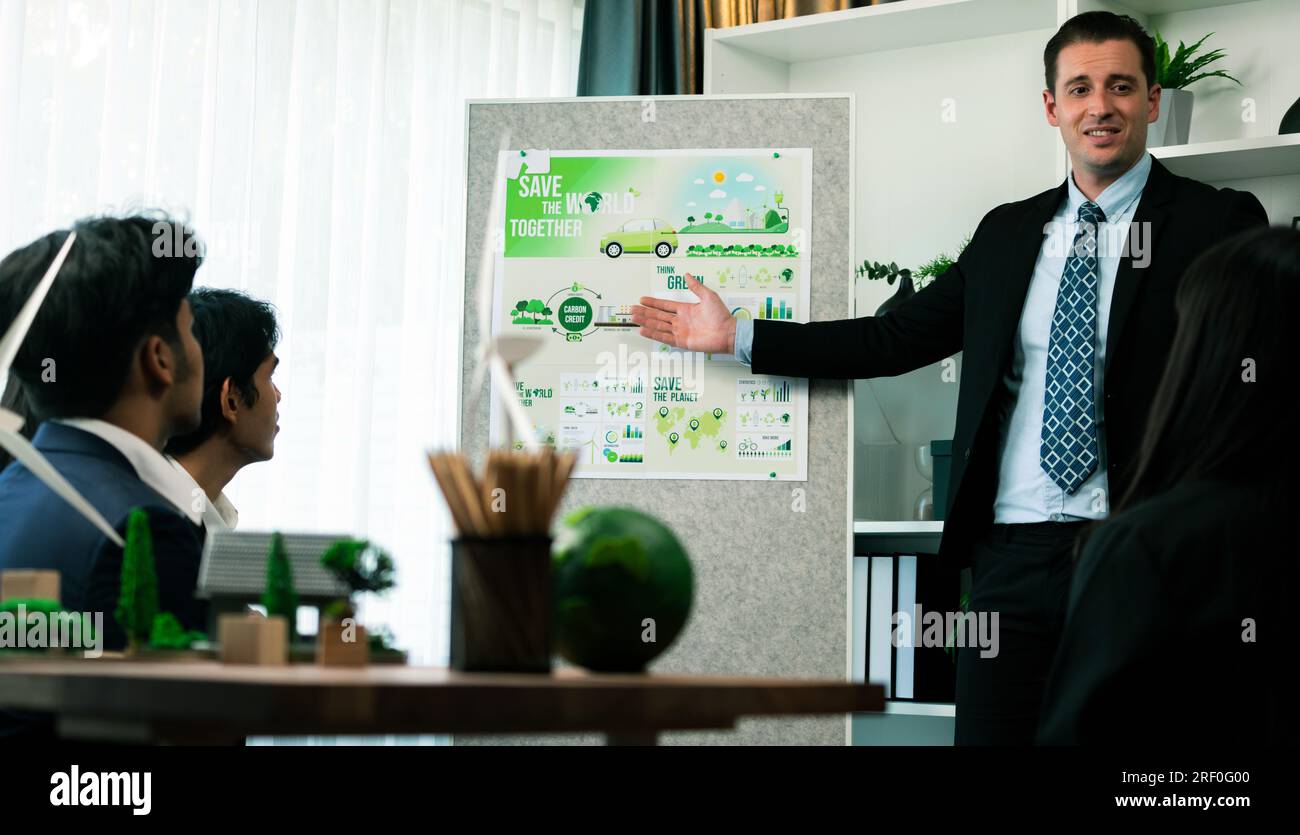 Businessman leader give presentation on eco-friendly implementation in ... Businessman leader give presentation on eco-friendly implementation in ...